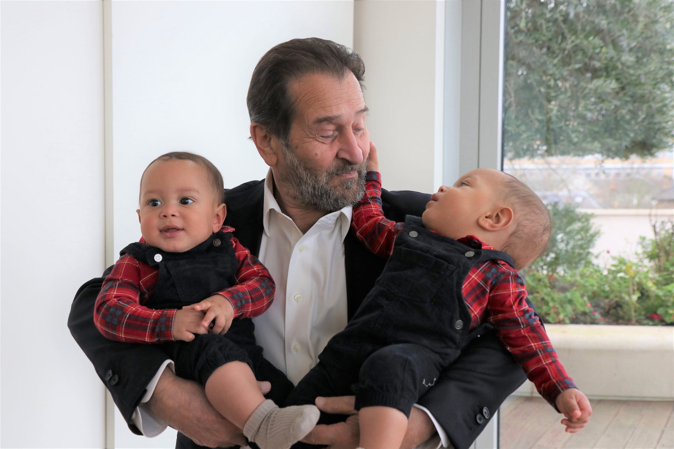 Twins meet surgeon who saved their lives before they were born | King's ...